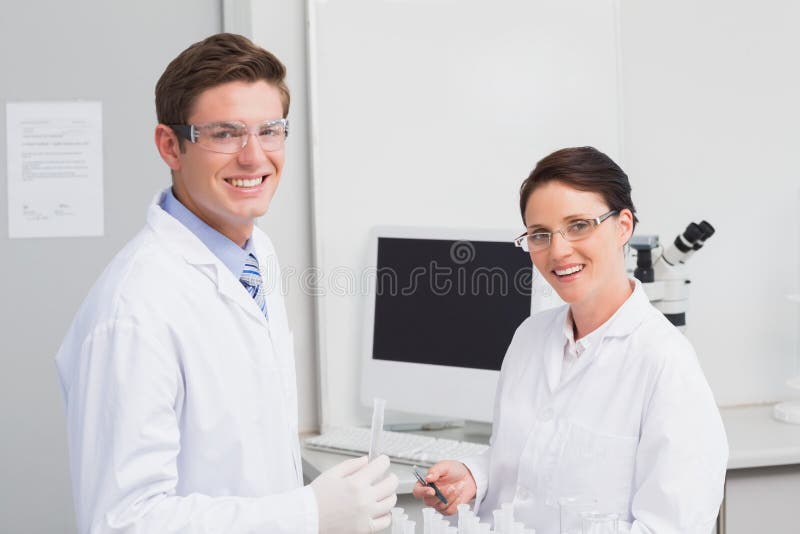 Scientists Smiling and Looking at Camera Stock Photo - Image of female ...