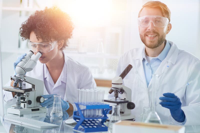 Smiling Scientists Looking at Camera Arms Crossed in Laboratory Stock ...