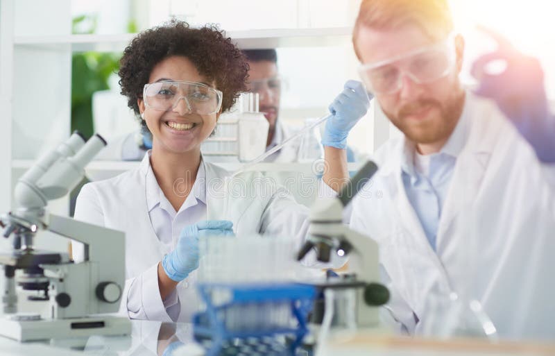 Smiling Scientists Looking at Camera Arms Crossed in Laboratory Stock ...
