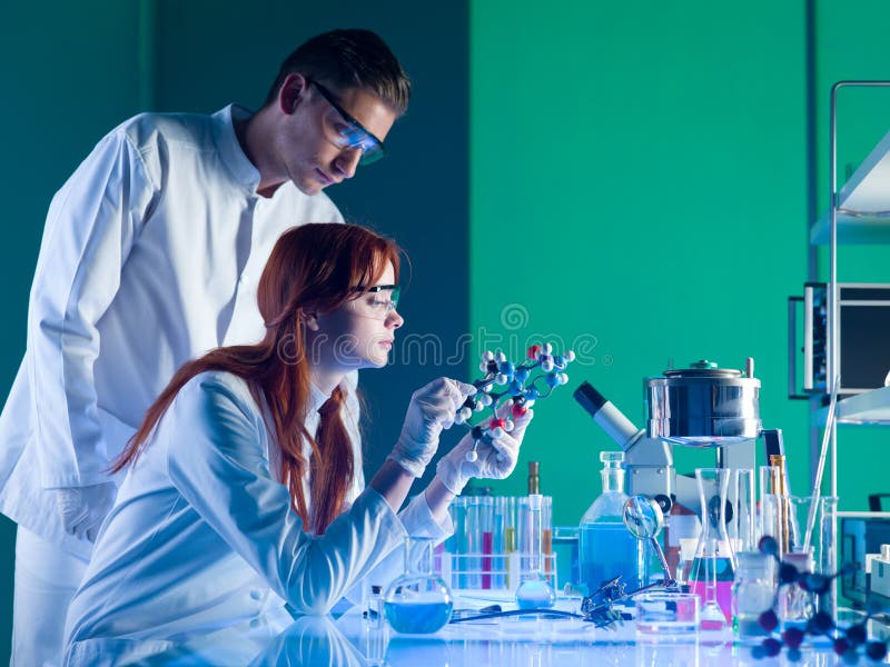 Scientists Studying a Molecular Structure Stock Photo - Image of ...