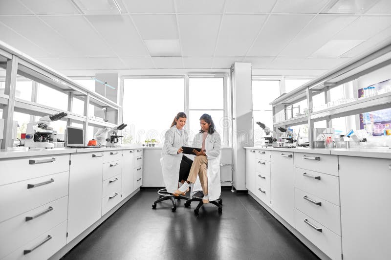 Scientists with Tablet Pc Working in Laboratory Stock Photo - Image of ...
