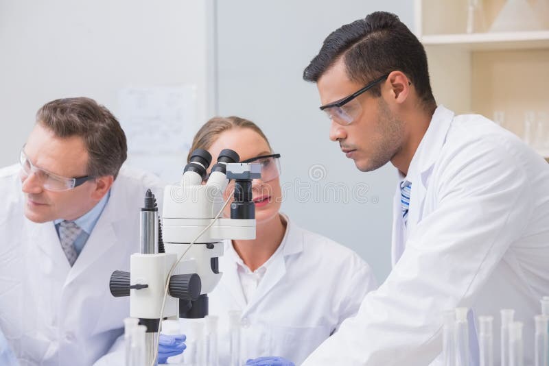 Scientist Speaking To His Colleague Holding Clipboard Stock Image ...