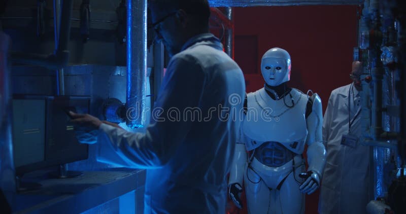 Scientists Testing Humanoid Robot Stock Photo - Image of examining ...