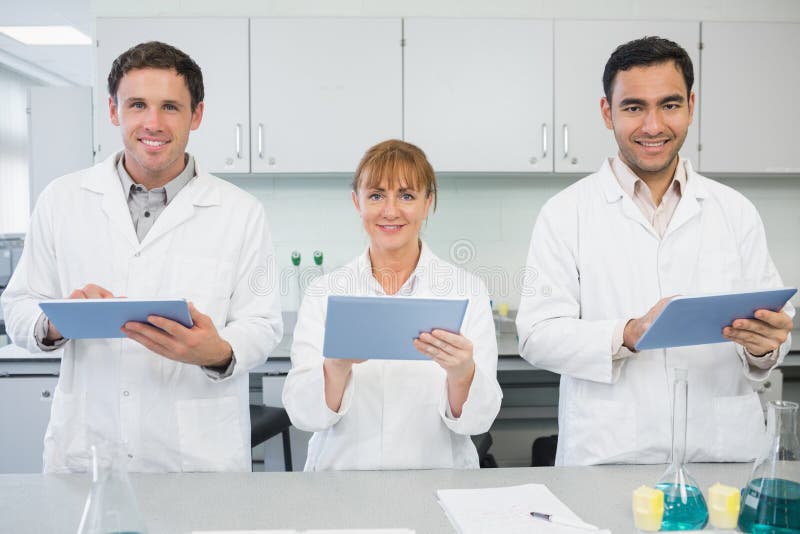 Scientists Using Tablet PCs in the Lab Stock Photo - Image of looking ...