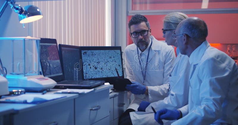 Scientists Watching Monitor and Analyzing Stock Photo - Image of ...