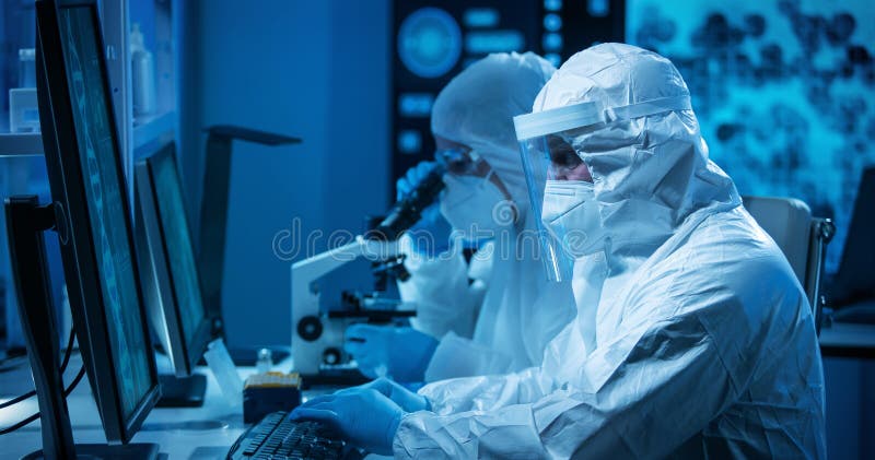 Scientists Work in a Modern Scientific Lab Using Laboratory Equipment ...