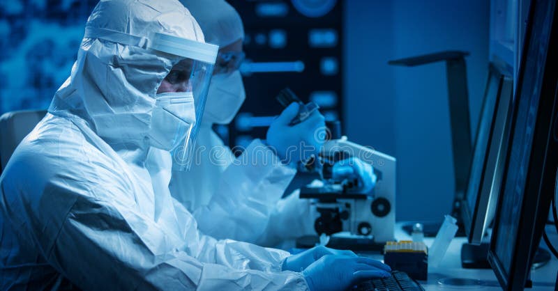 Scientists Work in a Modern Scientific Lab Using Laboratory Equipment ...