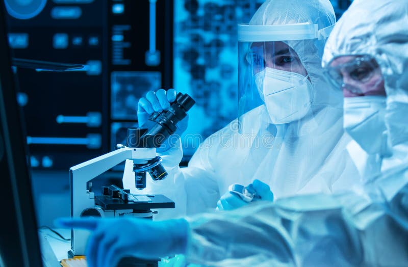 Scientists Work in a Modern Scientific Lab Using Laboratory Equipment ...