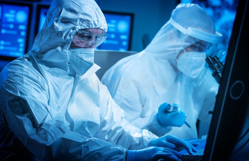 Scientists Work in a Modern Scientific Lab Using Laboratory Equipment ...