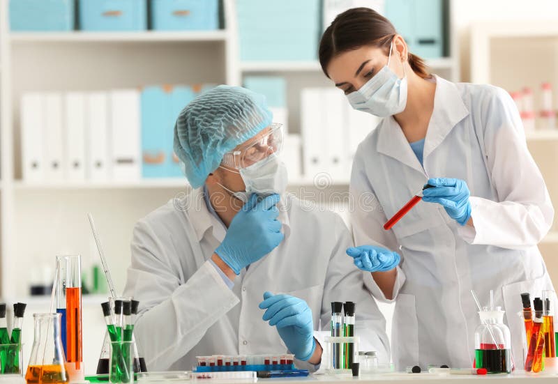 Scientists Working in Laboratory Stock Photo - Image of indoors, gloves ...