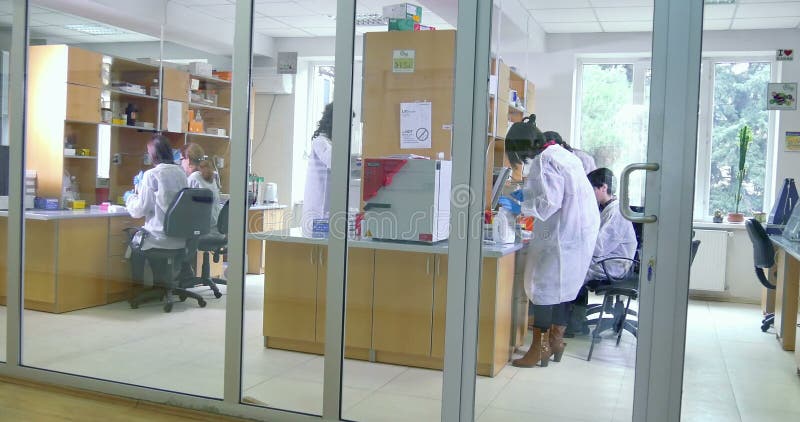 Scientists Working on Pharmaceutical Industry in a Clean Room. Stock ...