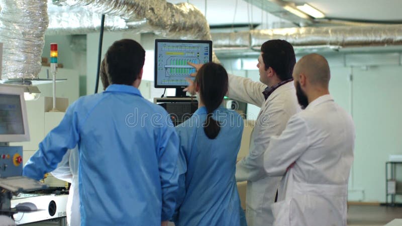 Scientists Working on Pharmaceutical Industry in a Clean Room. Stock ...