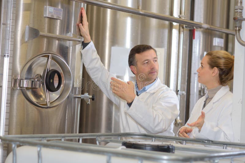 Scientists Working with Large Vat in Lab Stock Photo - Image of ...