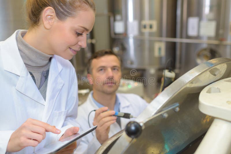 Scientists Working with Large Vat in Lab Stock Photo - Image of energy ...