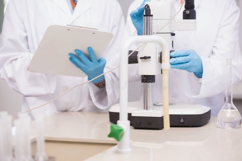 Scientists taking notes stock photo. Image of african - 53089188