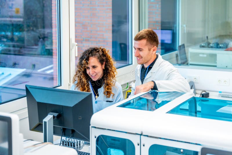 Scientists Working in a Pathology Analysis Laboratory in a Hospital ...
