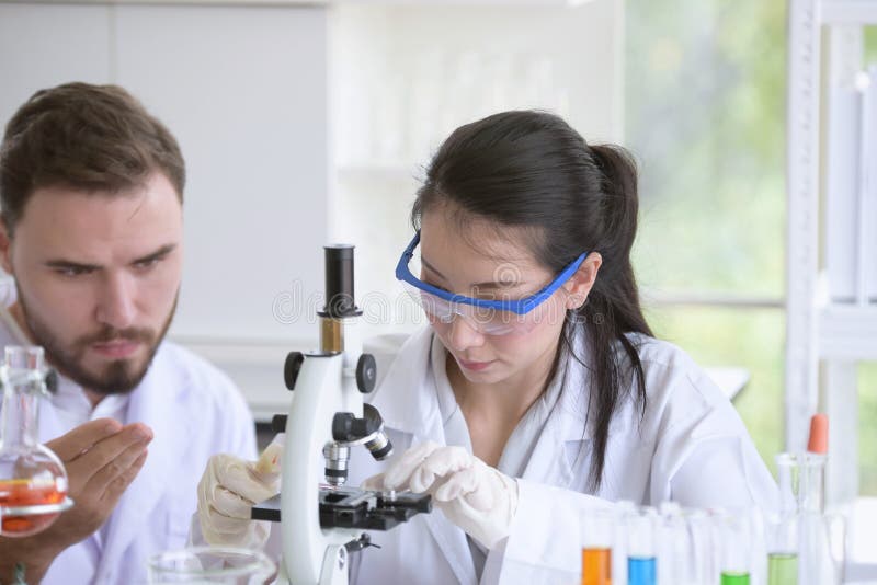 Scientists are Working in Science Labs.Close-up of a ScientistYoung ...