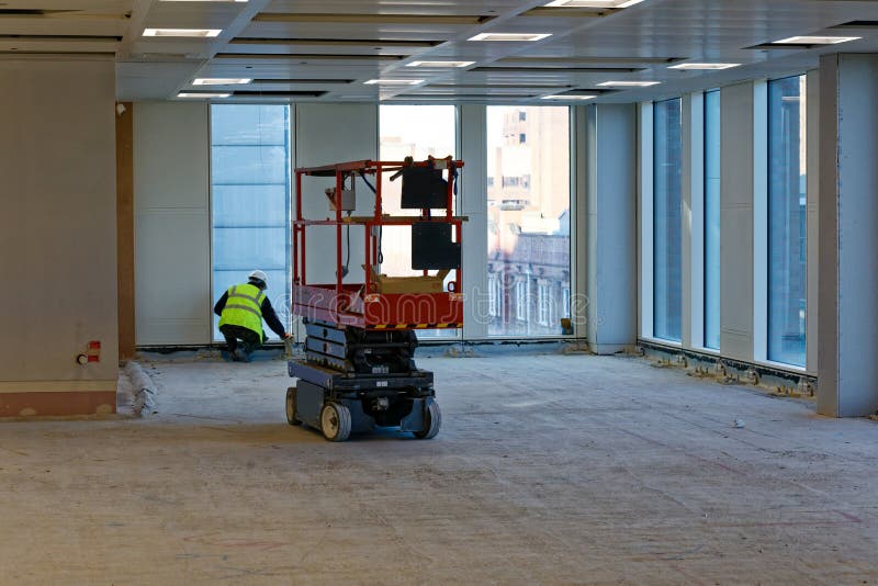 Scissor lift inside the building ready to work