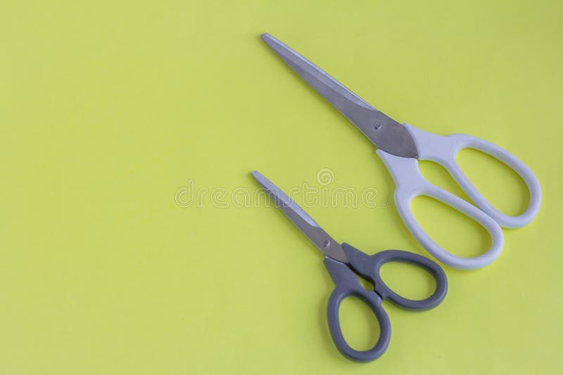 Black Scissors on a Yellow Background.Small Scissors for Cutting Stock ...