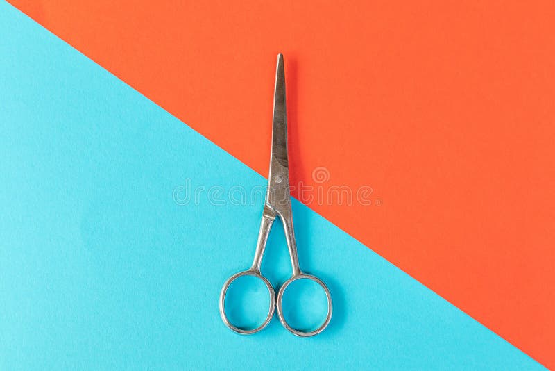 Black Scissors on Blue and Red Color Paper Texture Background. Stock ...