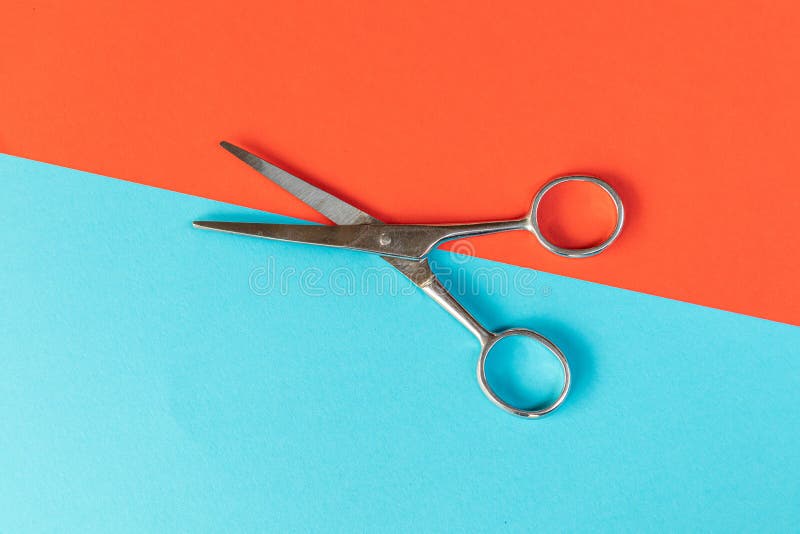 Scissors on Blue and Red Color Paper Texture Background. Stock Photo ...