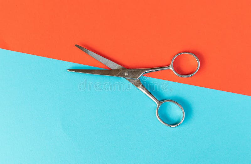 A Scissors on Blue and Red Color Paper Texture Background. Stock Photo ...