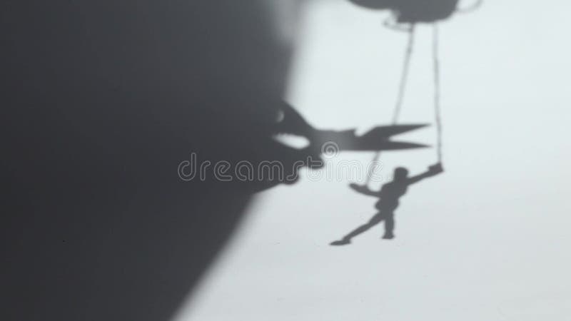 Scissors Cut the Rope on Which the Puppet Hangs on the Shadow Stock ...
