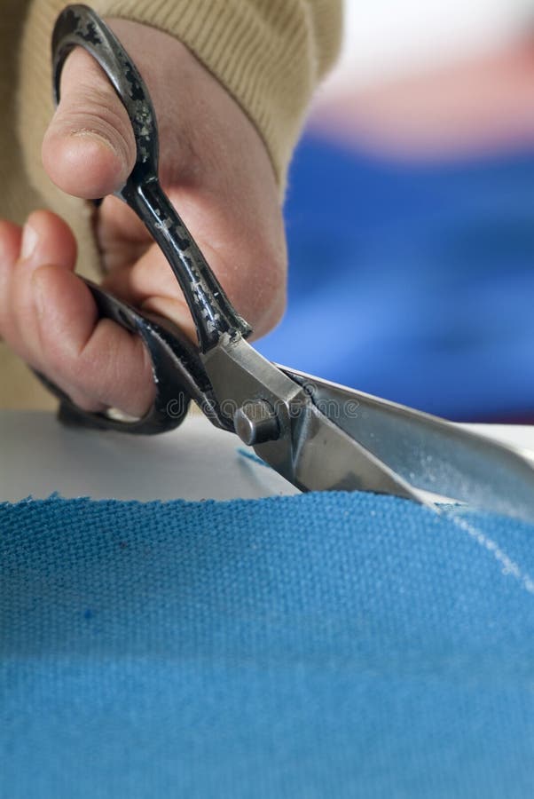 Scissors cutting cloth stock image. Image of clothing - 24665135