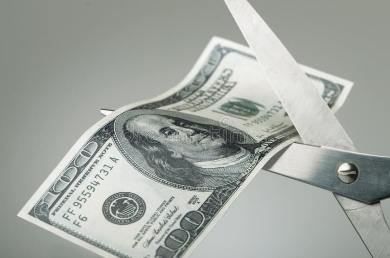 Scissors Cutting a Dollar Bill in Half Stock Photo - Image of consumer ...