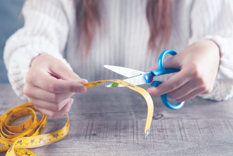 Scissors Cutting the Measuring Tape Stock Image - Image of measuring ...