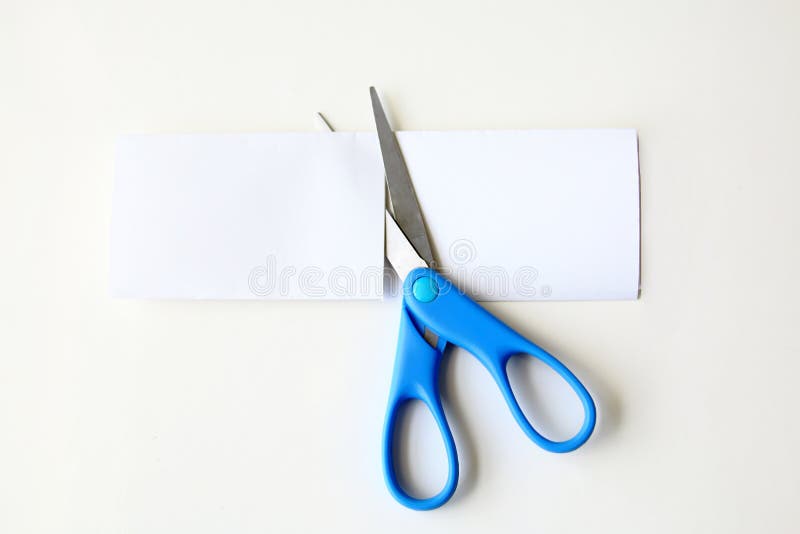 Scissors cutting a paper stock image. Image of scissors - 51204189