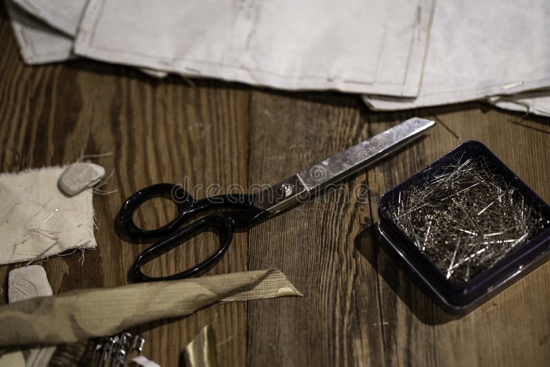 Scissors, Cutting Paper Pattern with Light Beige Fabric. Close-up ...