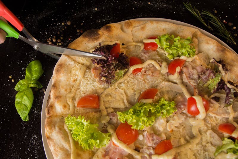 Scissors cutting pizza stock image. Image of italian - 180492047