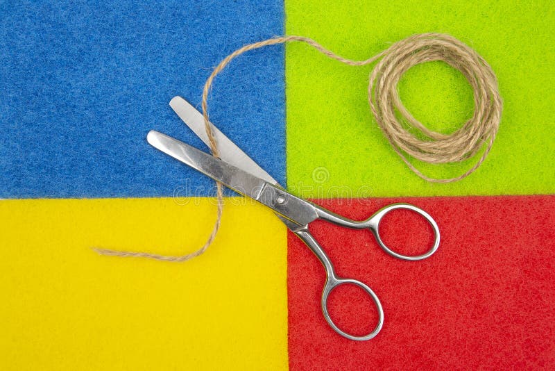 Scissors for Cutting and Rope on a Colored Background Stock Photo ...