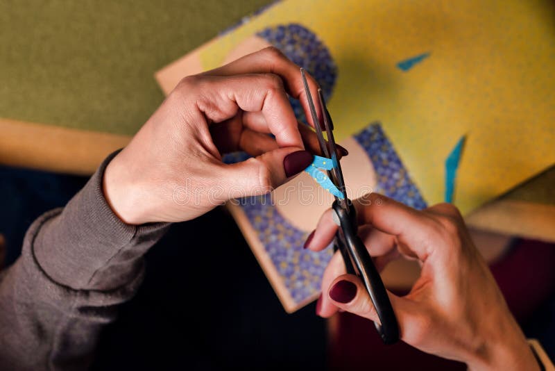 Scissors in Female Hands Close-up. Top View of the Process of Cutting ...