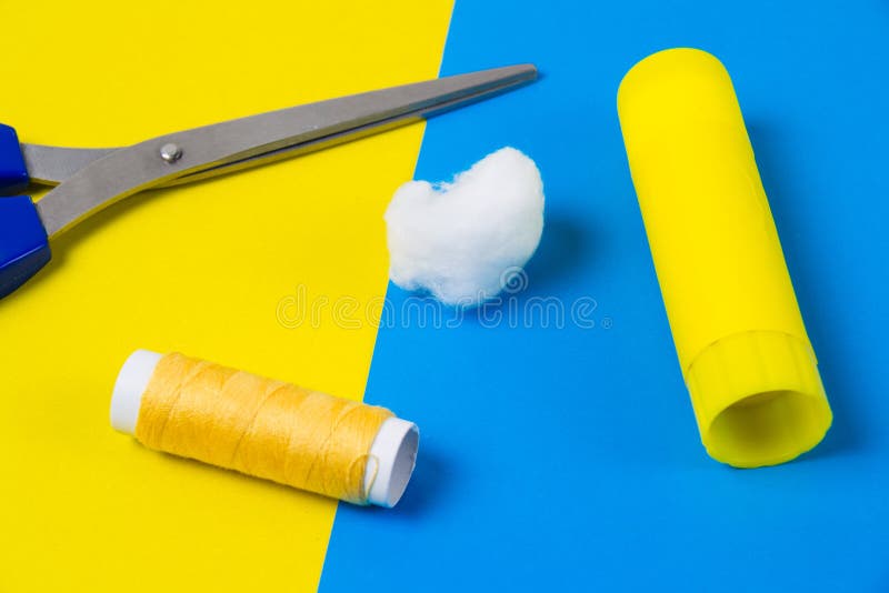 Scissors, Glue, Cotton Wool and Threads on Multi-colored Sheets of ...