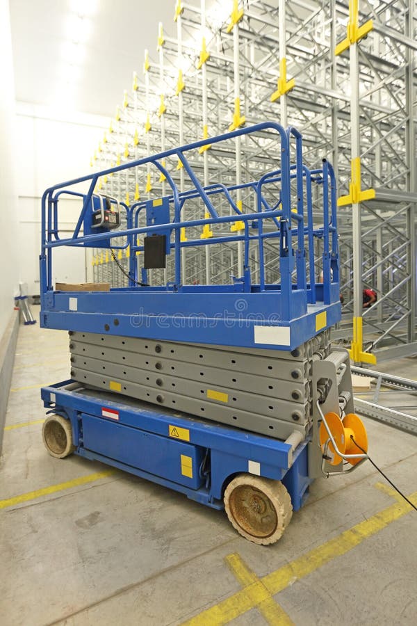 Scissors Lift Warehouse stock photo. Image of storage - 152819326