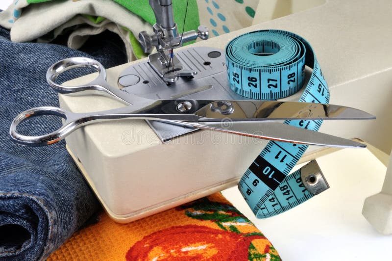 Scissors and Seamstress`s Meter on a Sewing Machine Stock Photo - Image ...
