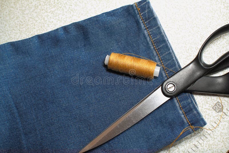 Scissors, Thread, and Jeans on the Desktop. Stock Image - Image of ...