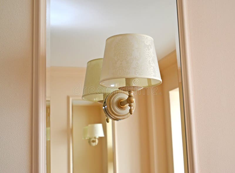 Sconce on a Mirror Panel in the Room Stock Photo - Image of reflection ...