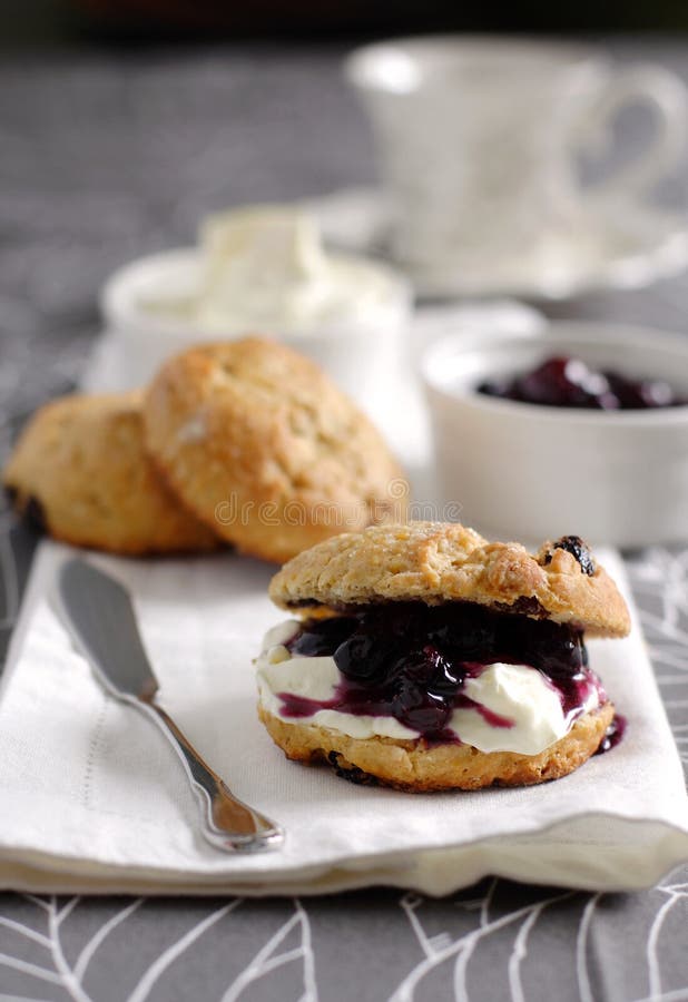 Scone with jam and cream stock photo. Image of dairy, spread - 9947468