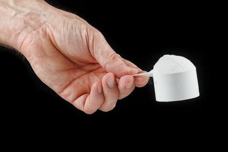 Scoop with gainer in hand stock image. Image of training - 267211563