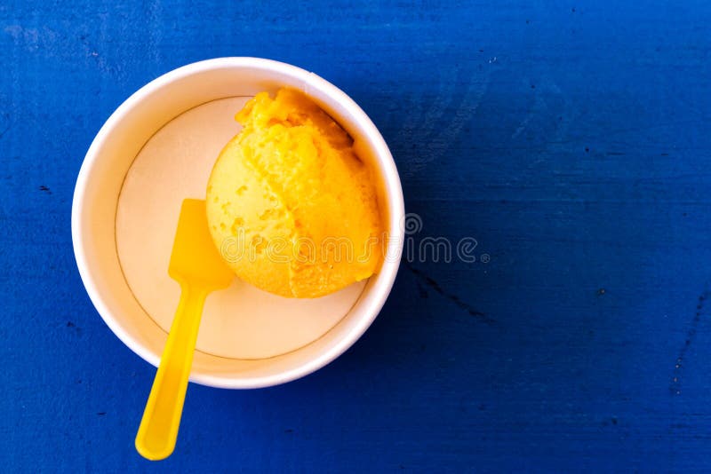 Scoop of Mango Ice Cream in Paper Cup with Plastic Spoon Isolate Stock ...