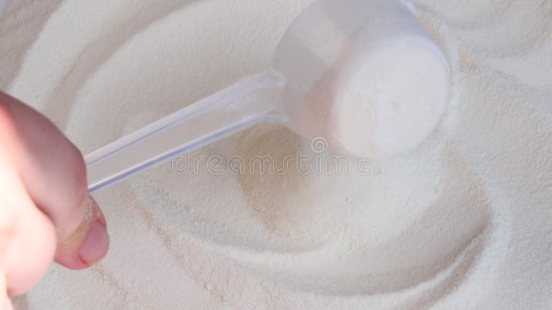 Scoop of Protein Powder Rotating in Circle with Fine Smooth Texture on ...