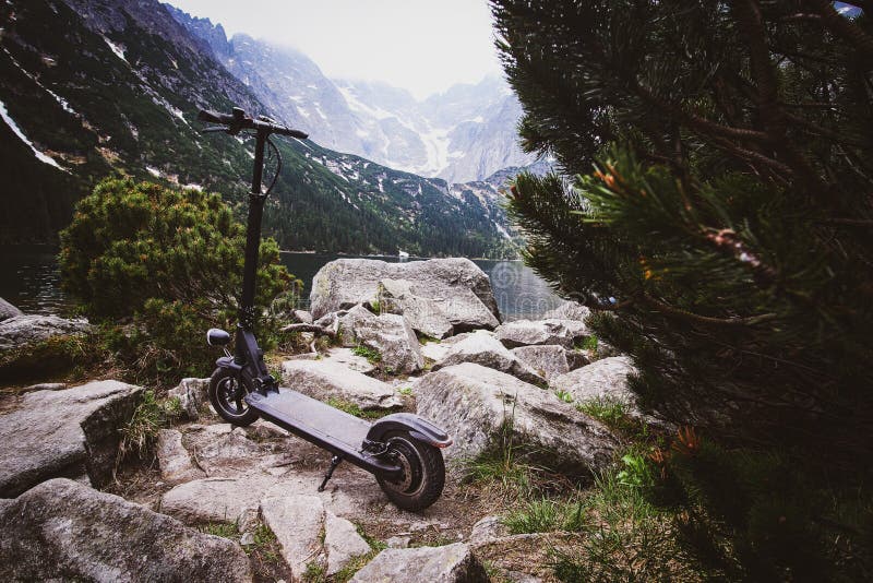 Scooter in the Beautiful Mountains with Pine and Low Clouds Stock Image ...