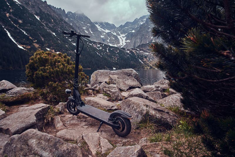 Scooter in the Beautiful Mountains with Pine and Low Clouds Stock Image ...