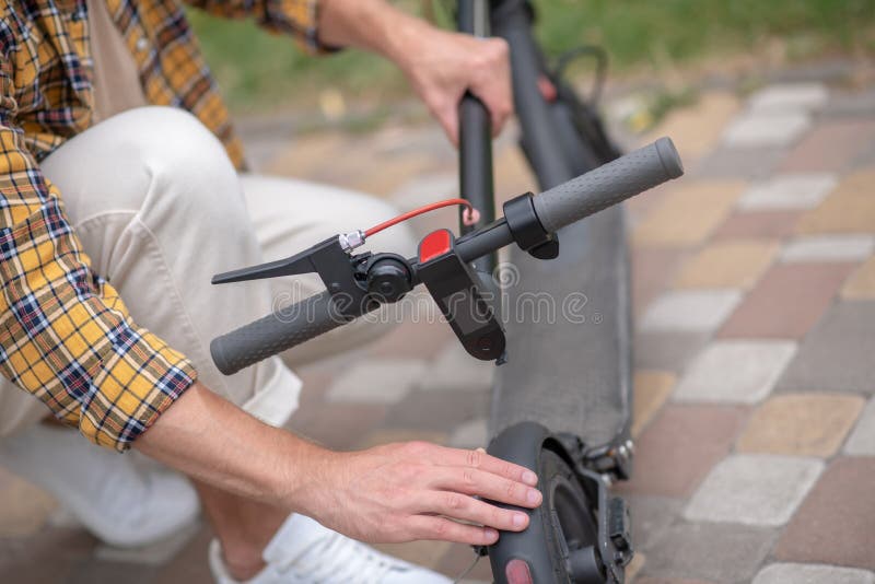 Close Up Picture of a Man Fixing His Scooter Stock Image - Image of ...
