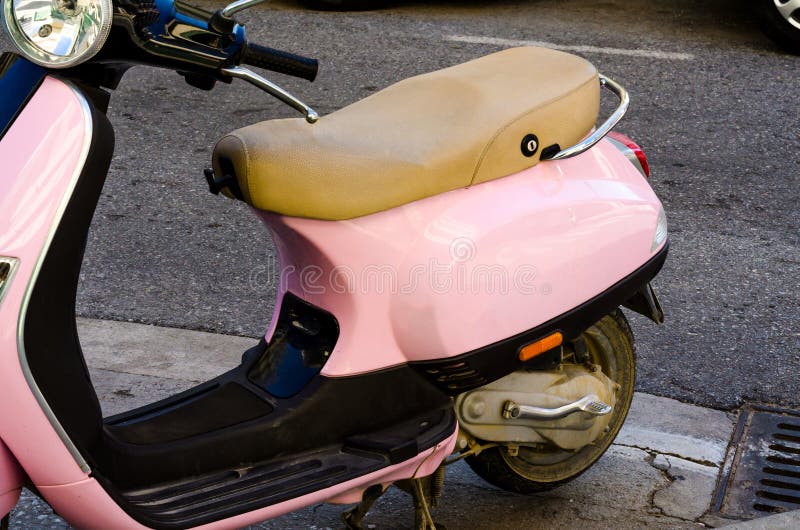 A Scooter Parked on a Narrow Spanish Street by the Side of a Building ...
