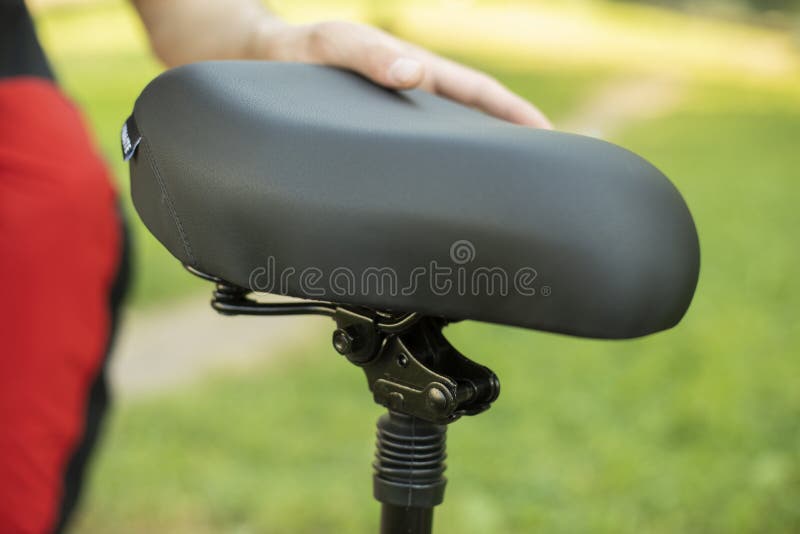 Scooter Seat. the Hand Rests on the Seat of the Bike Stock Image ...