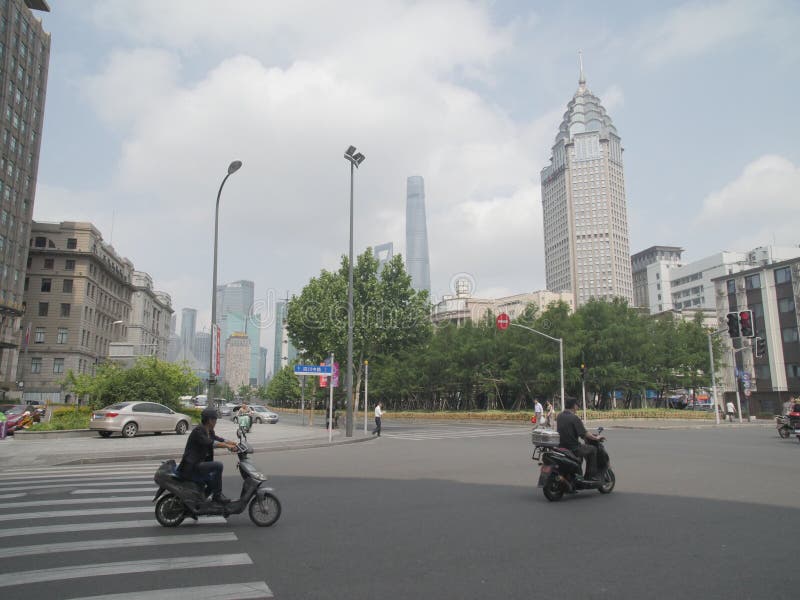 Scooters Pulling into Intersection in Shanghai, China. Editorial ...